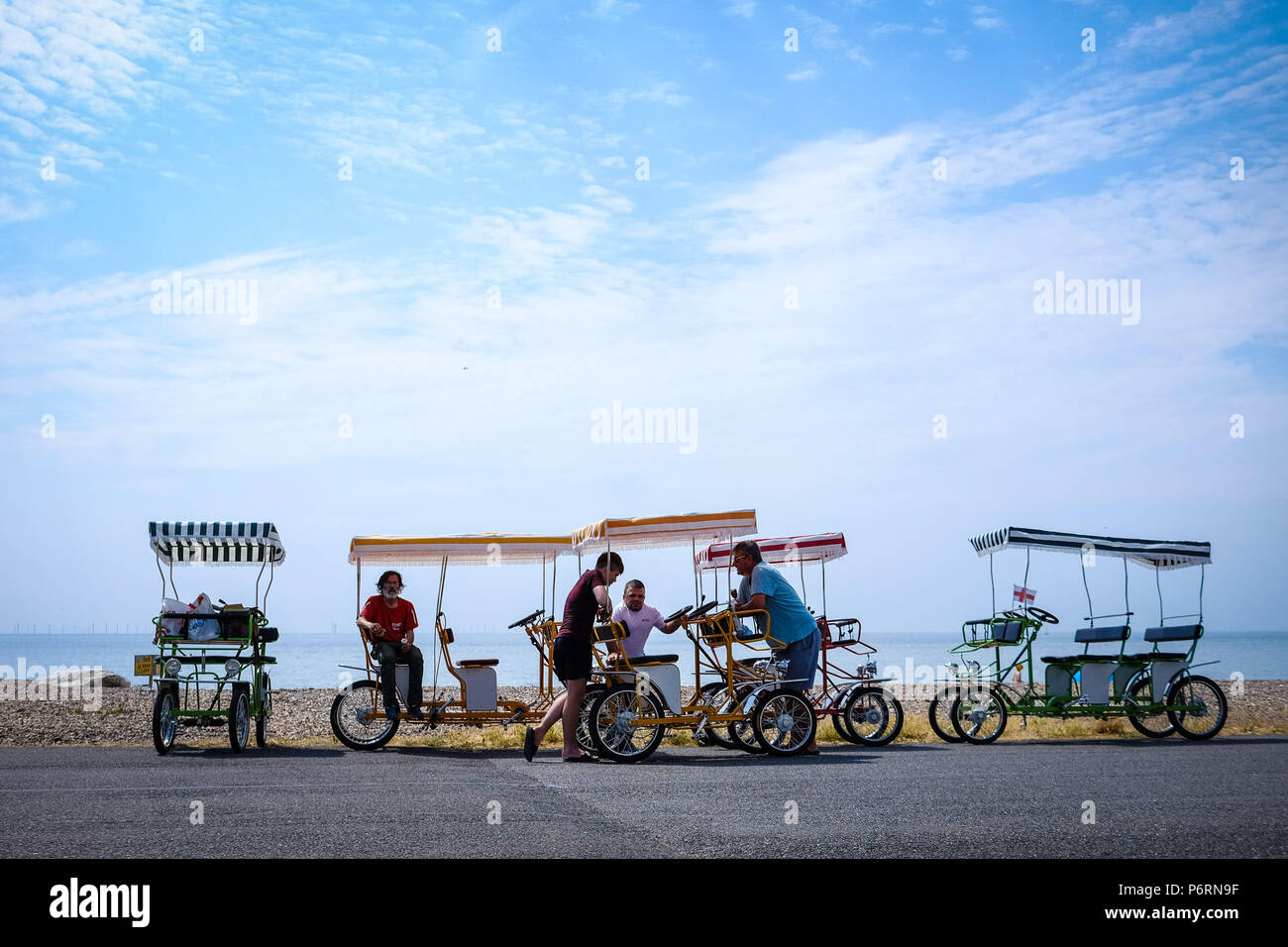 British Seaside life - 4 wheel cycles for hire on Worthing promenade ...