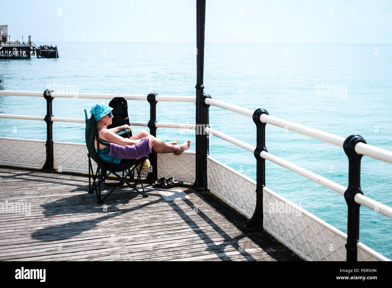 British Seaside life - A typical sunny beach scene on a pebbly beach ...