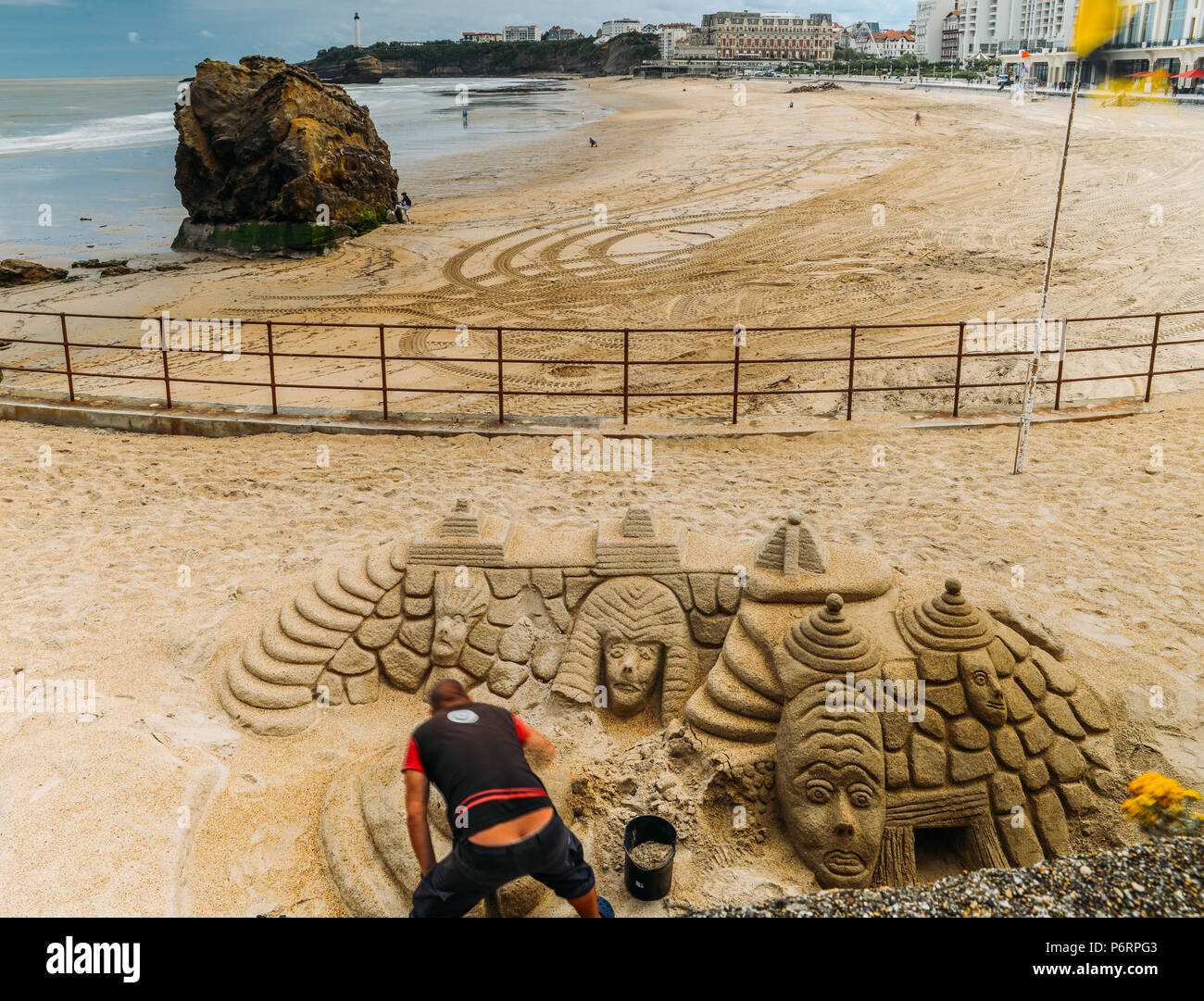 Man builds an elaborate sand castle at the Grande Plage beach in ...