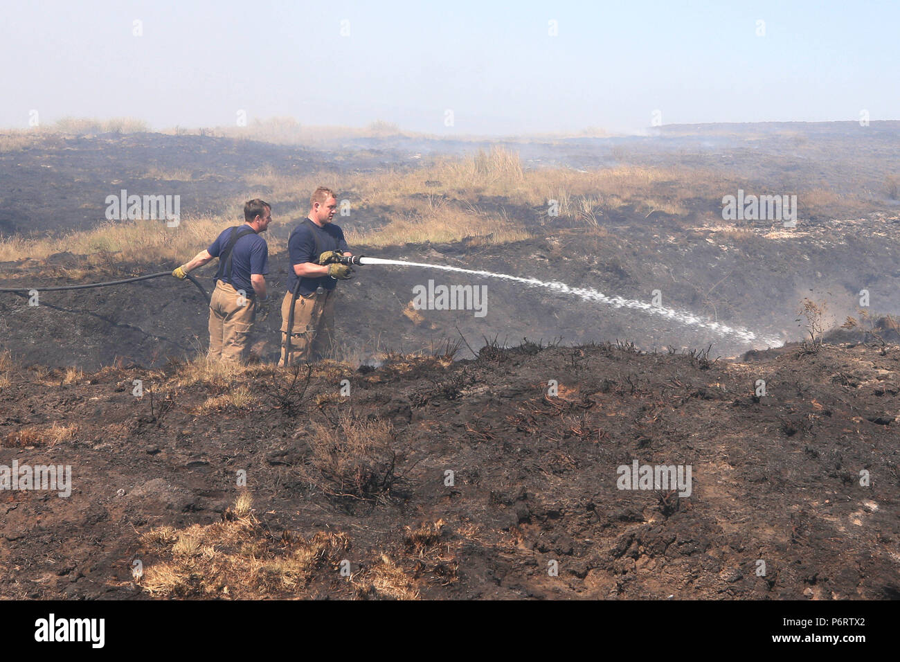 Firefighters from Tyne and Wear Fire and Rescue Service put out the ...