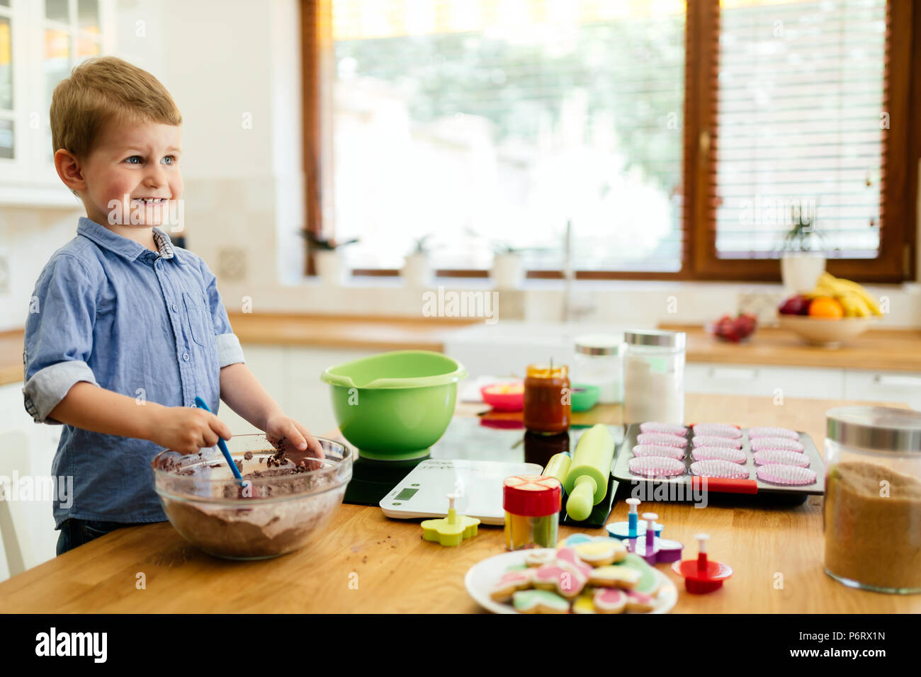 Adorable child making cookies Stock Photo - Alamy
