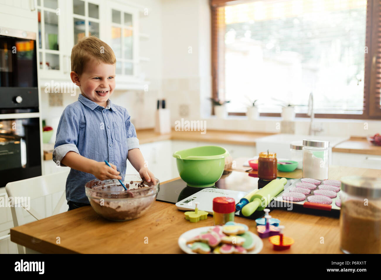 Adorable child making cookies Stock Photo - Alamy