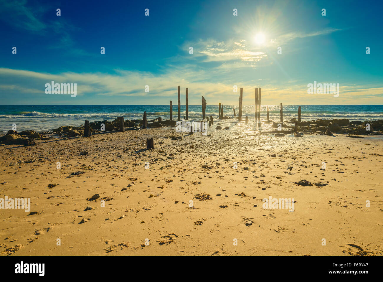 Port Willunga Beach jetty pylons at sunset, South Australia Stock Photo ...