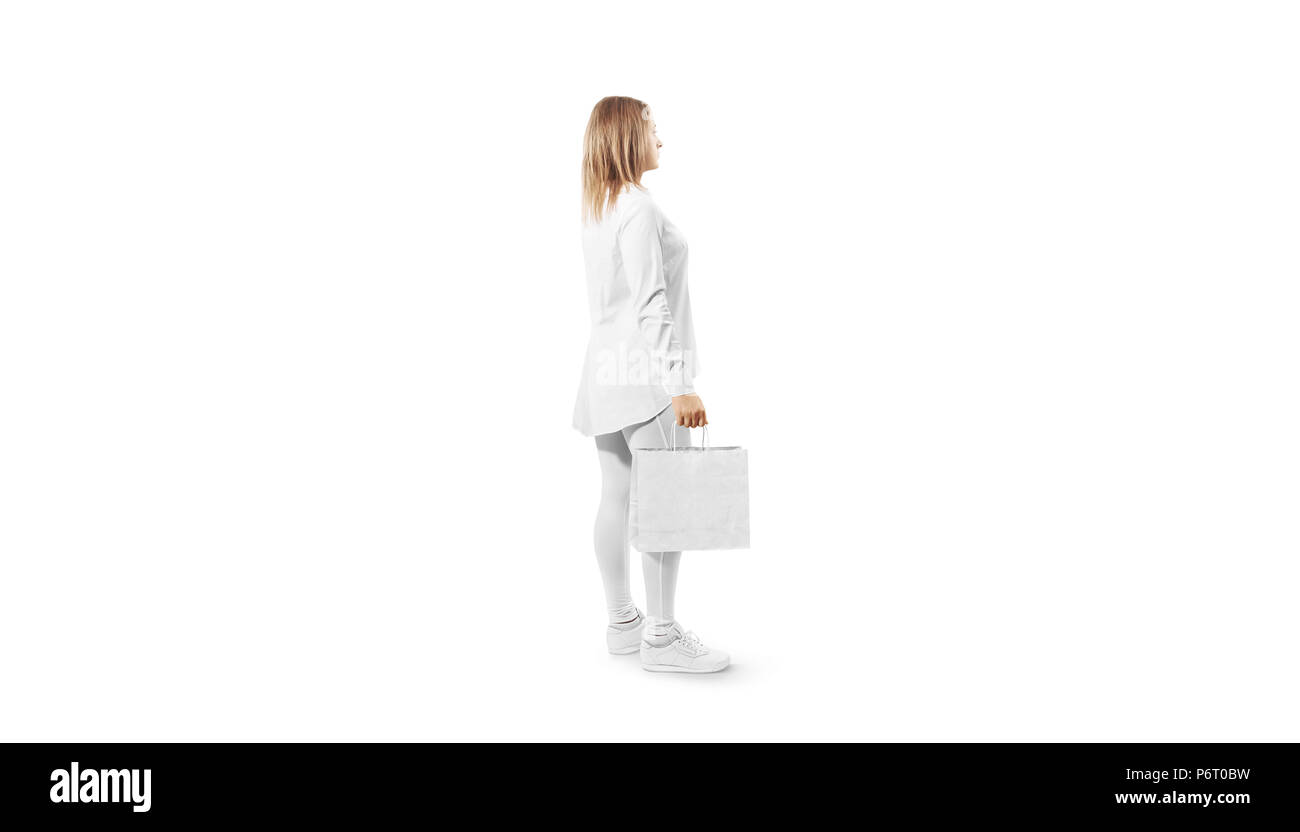 Women holding blank white craft paper bag mock up in hand, isolated ...