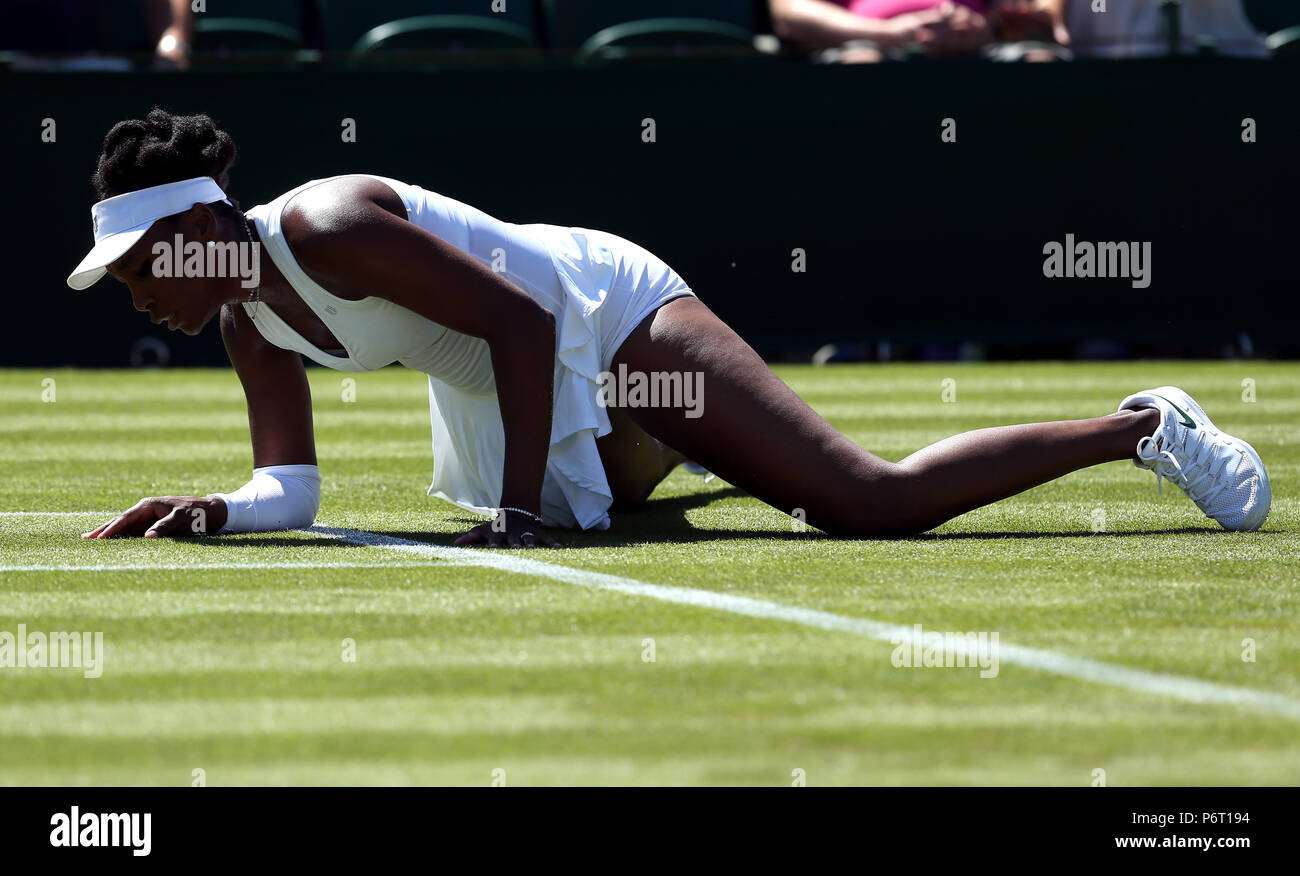 Venus Williams slips during a match on day One of the Wimbledon ...