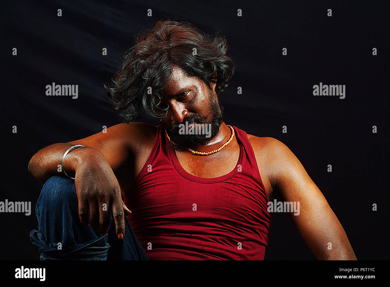 portrait of a young male model with serious look at camera Stock Photo ...