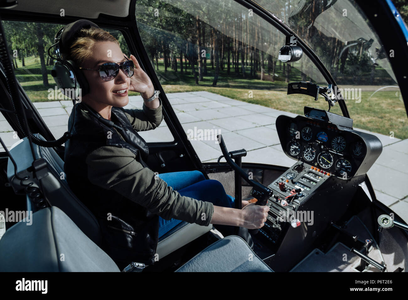 Gorgeous female helicopter pilot being about to start flight Stock Photo - Alamy
