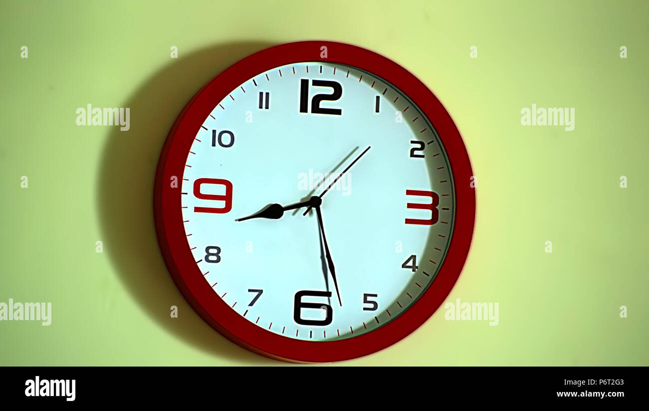classic red round wall clock isolated on wall, interior house Stock ...