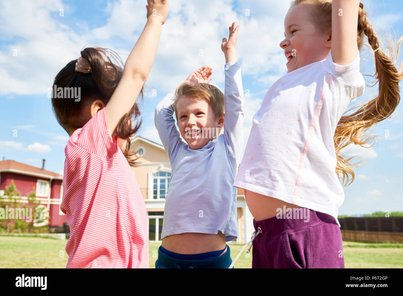 Happy Kids Playing Outdoors Stock Photo - Alamy
