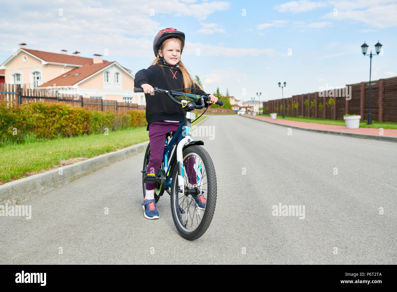 Girl Riding Bike Stock Photo - Alamy
