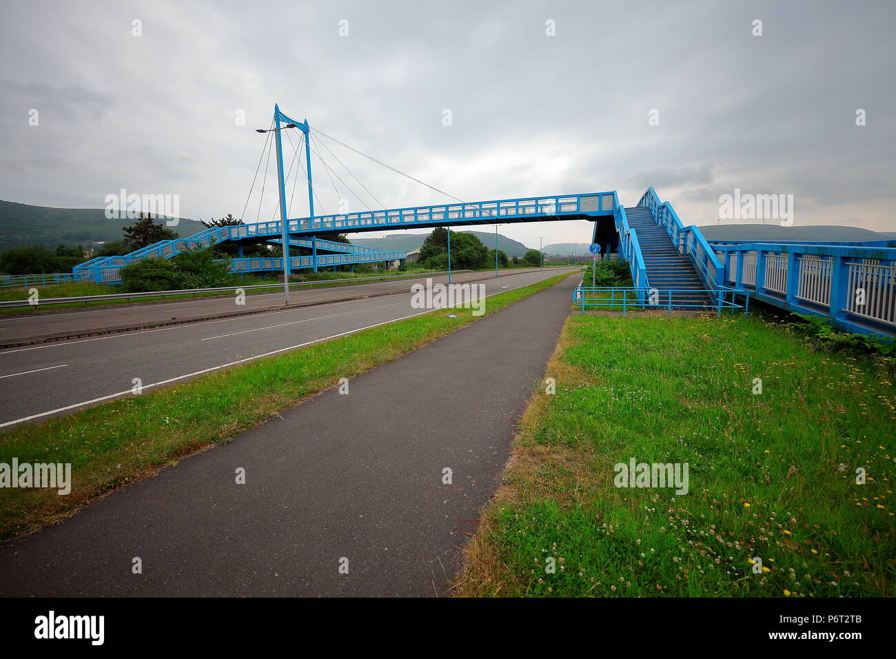 A fairly newly constructed road crossing bridge for pedestrians and ...