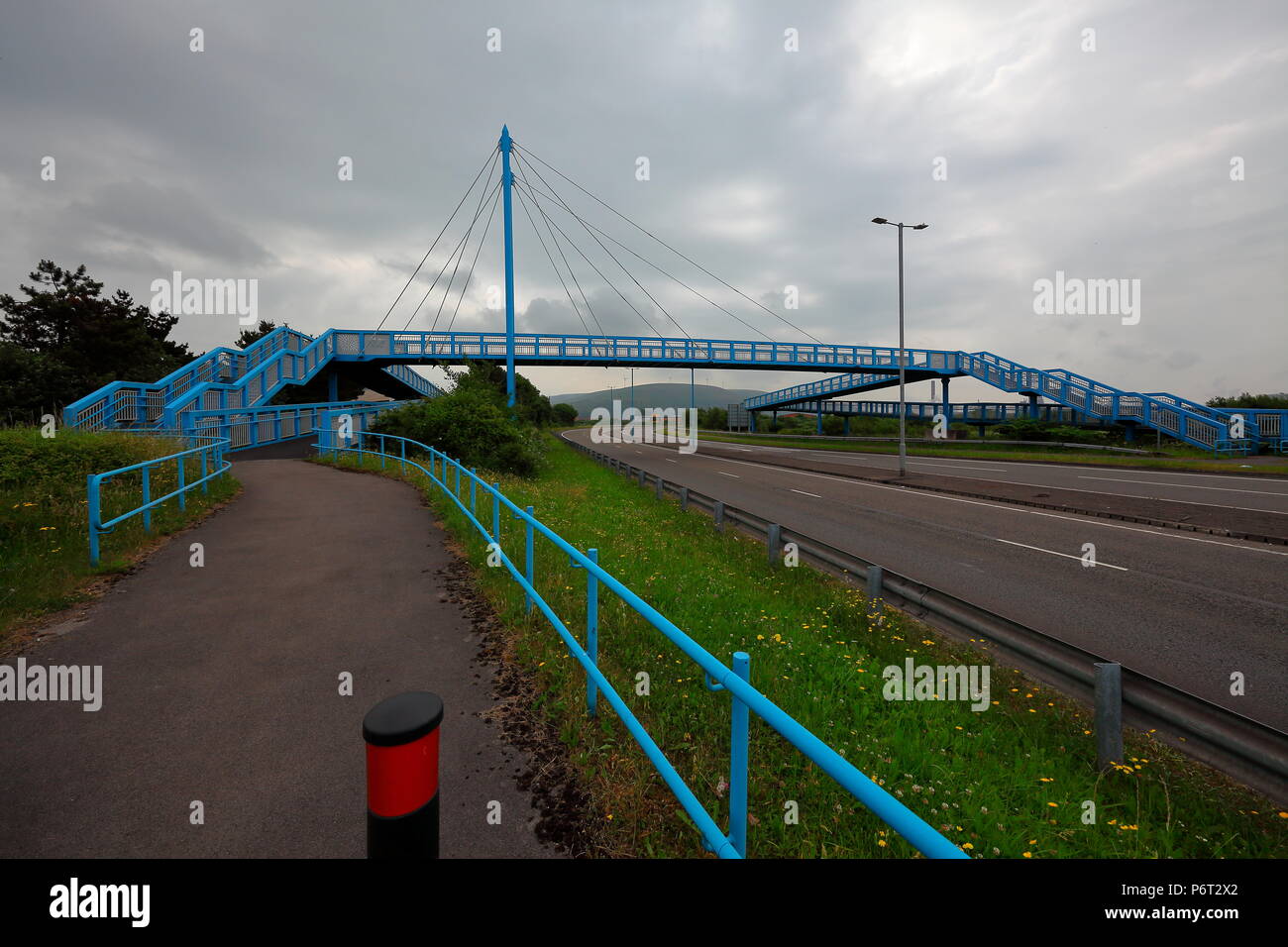 A fairly newly constructed road crossing bridge for pedestrians and ...