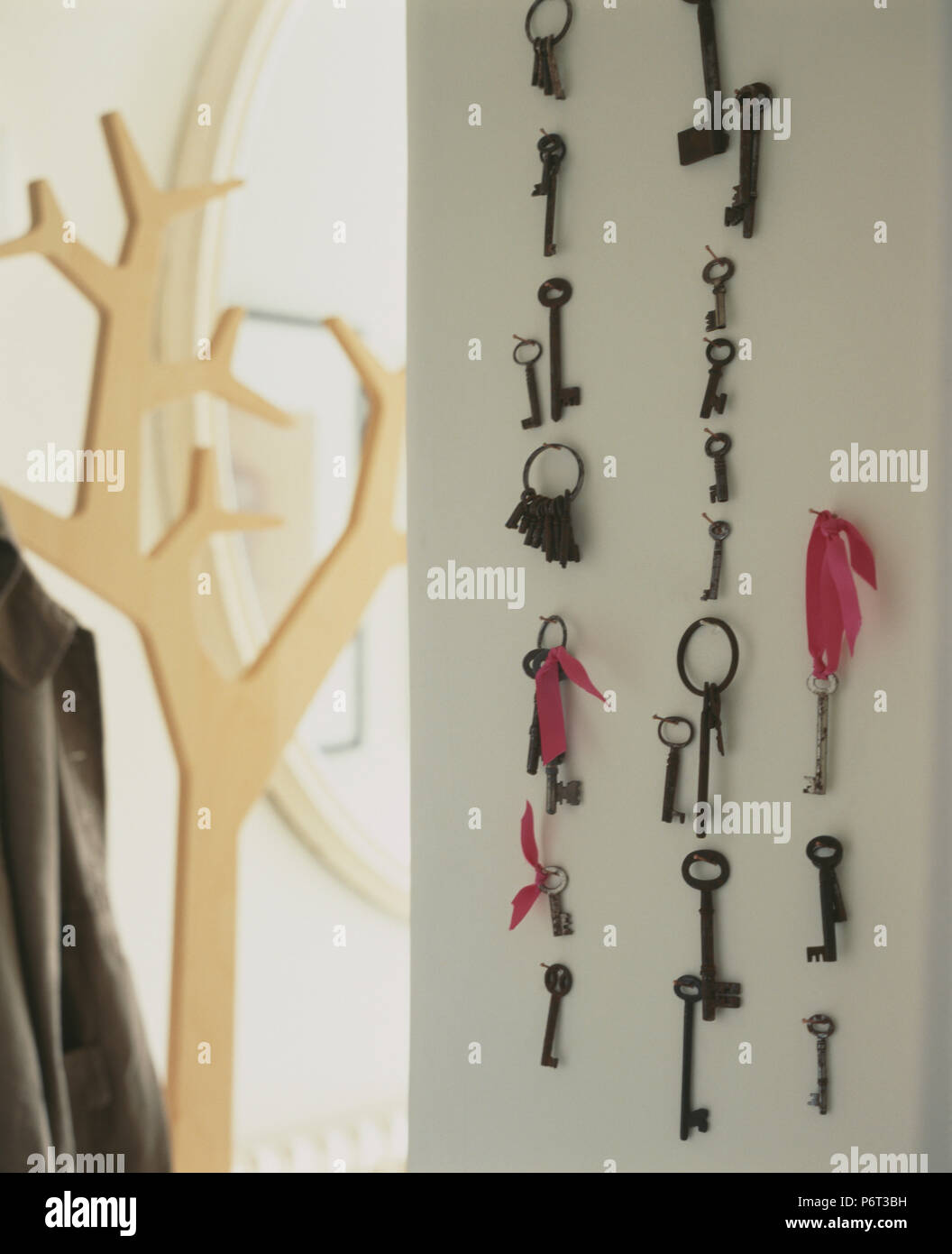 Close-up of collection of old keys on wall of modern hall Stock Photo ...