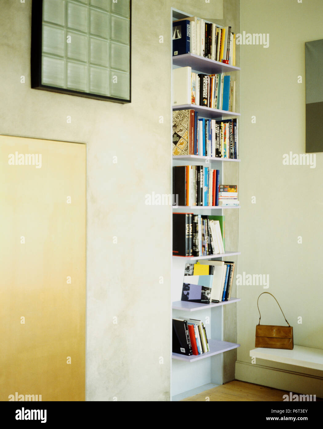 Books on alcove shelving in modern hall Stock Photo - Alamy