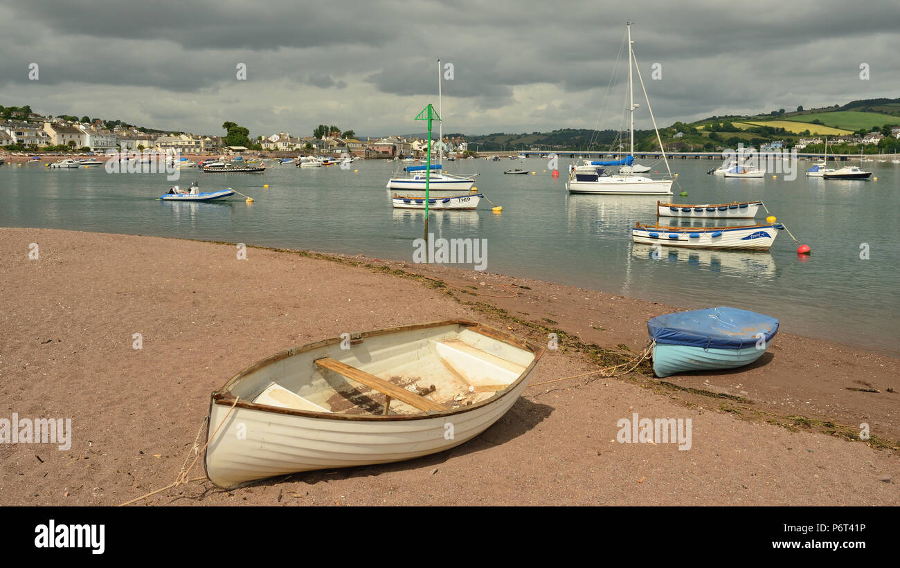 Boats moored in the Teign estuary at Teignmouth. Shaldon is situated on ...