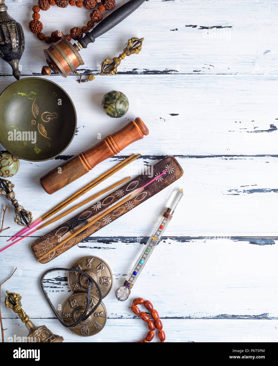 Copper singing bowl, prayer beads, prayer drum, stone balls and other ...