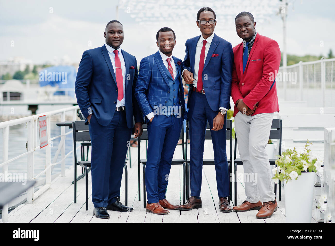 Group of four african american happy succesfull mans at suit. Rich ...