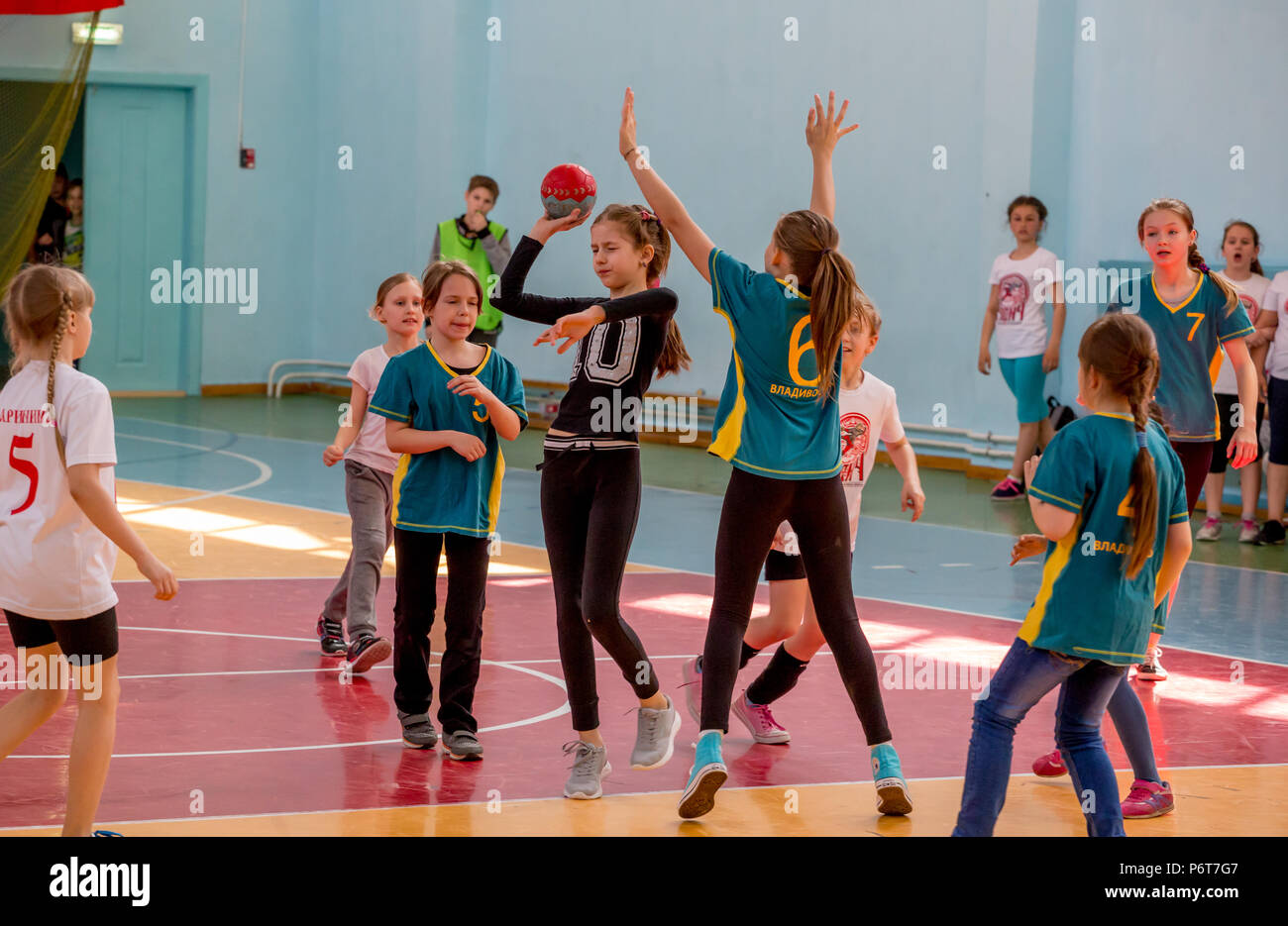 Russia, Vladivostok, 04/28/2018. Kids play handball indoor. Sports and ...