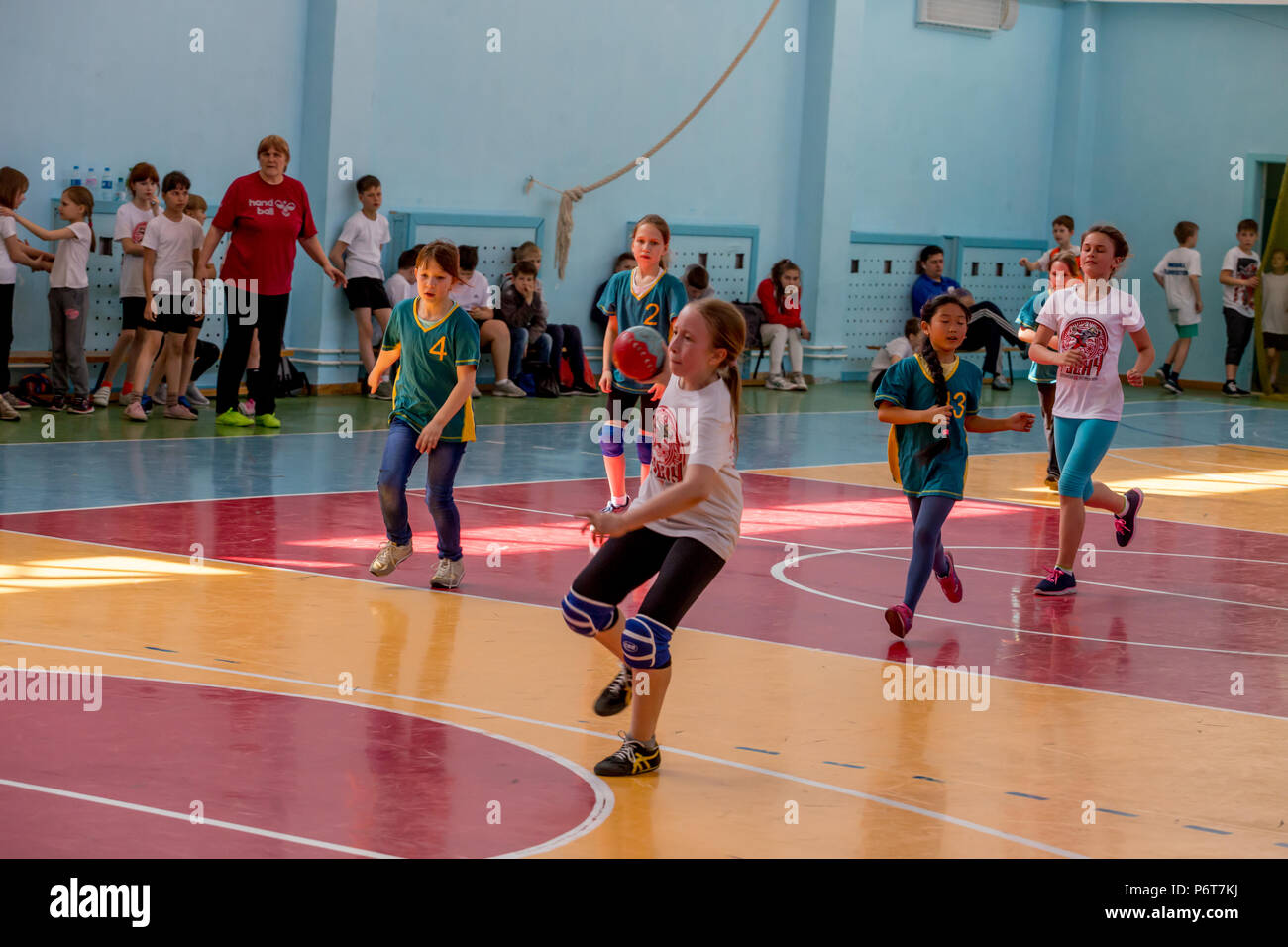 Children playing handball hi-res stock photography and images - Alamy