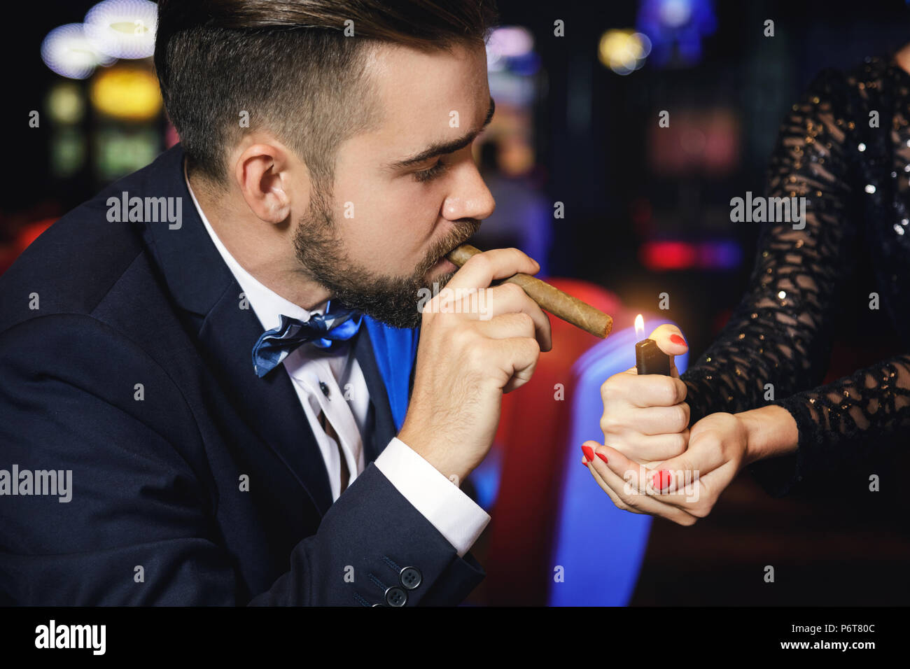 Man in suit smoking cigar hi-res stock photography and images - Alamy