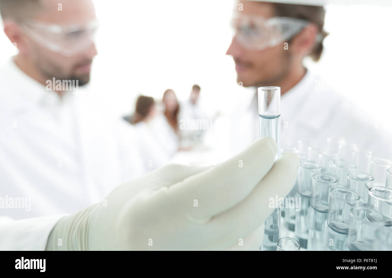scientist and assistant studying the solution in the tube Stock Photo ...