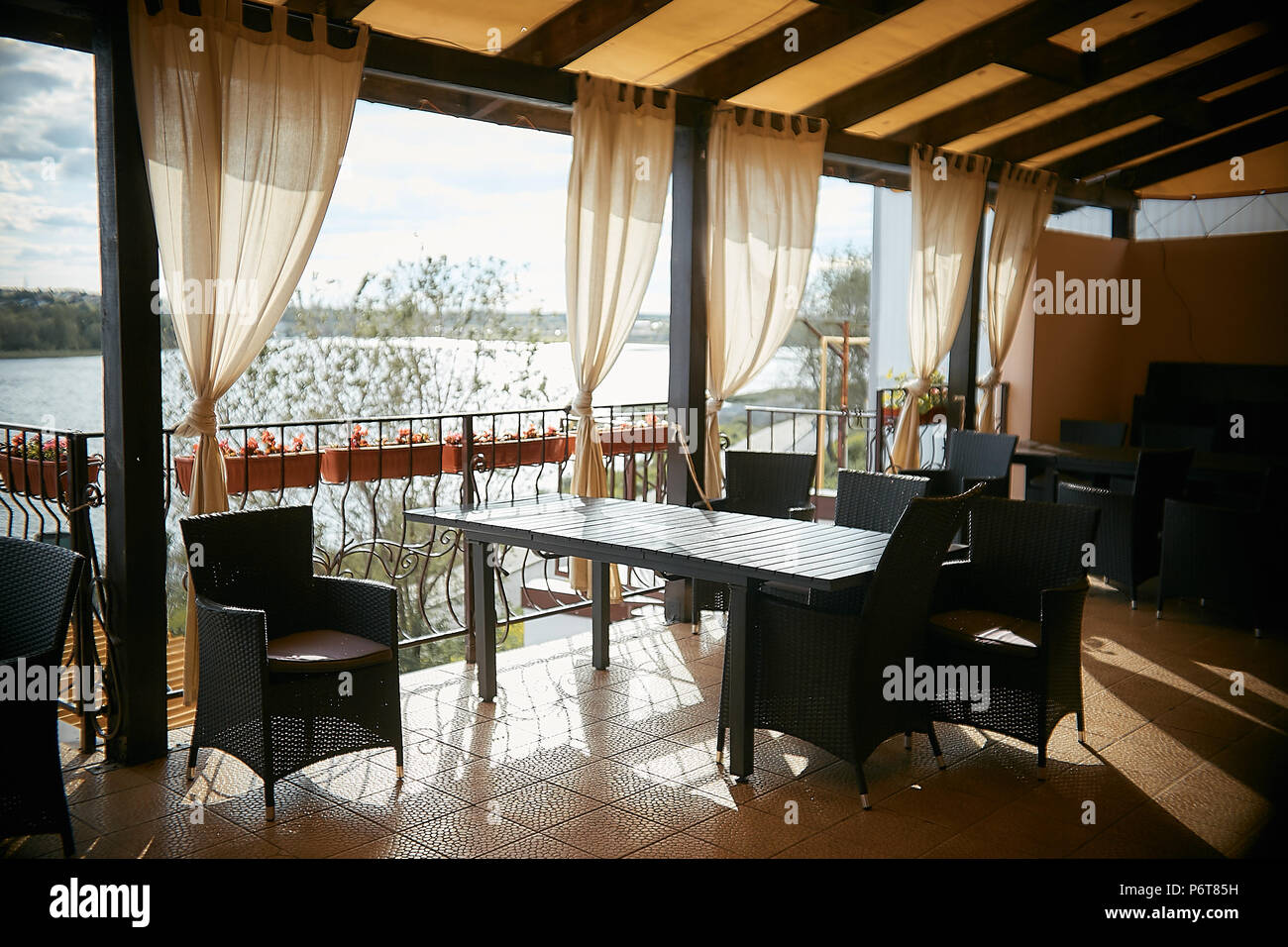 open terrace in an empty summer cafe overlooking the river Stock Photo ...