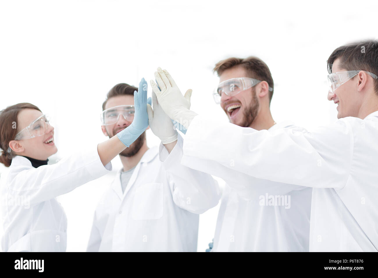 scientists giving each other a high five Stock Photo - Alamy