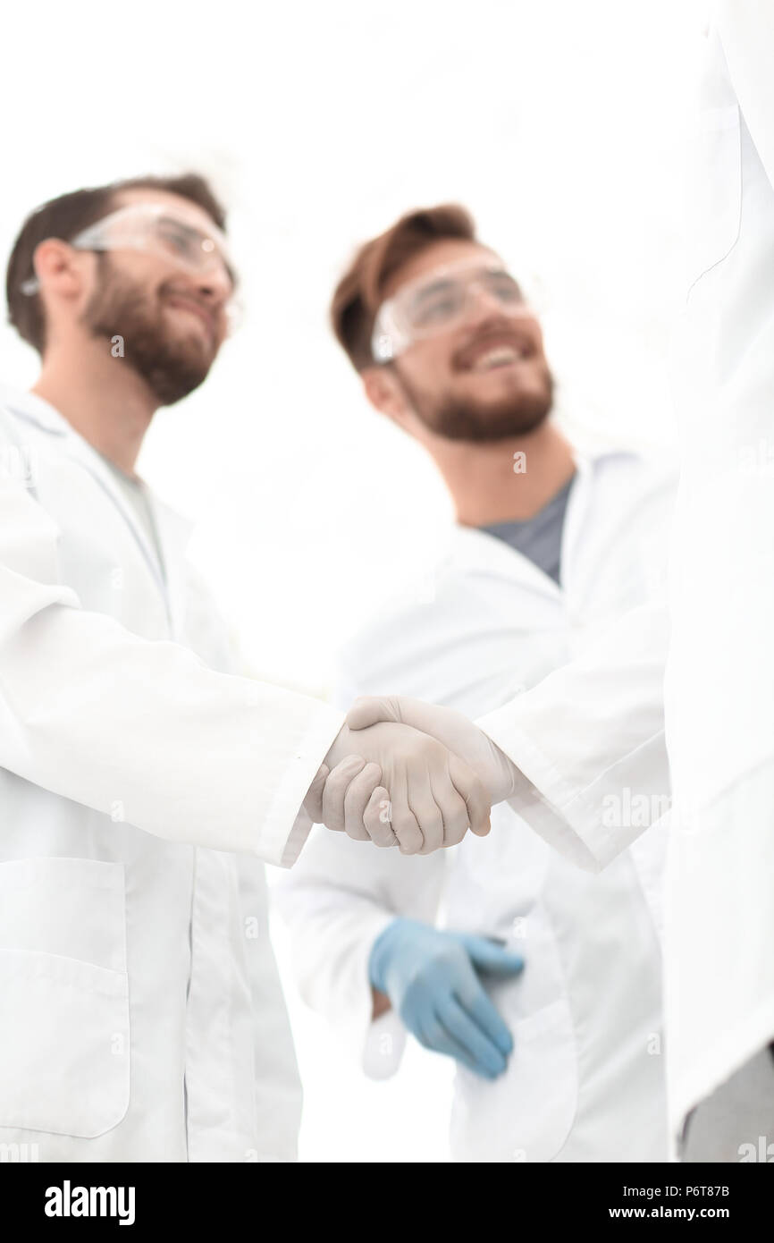 blurred image of a handshake between scientists Stock Photo - Alamy