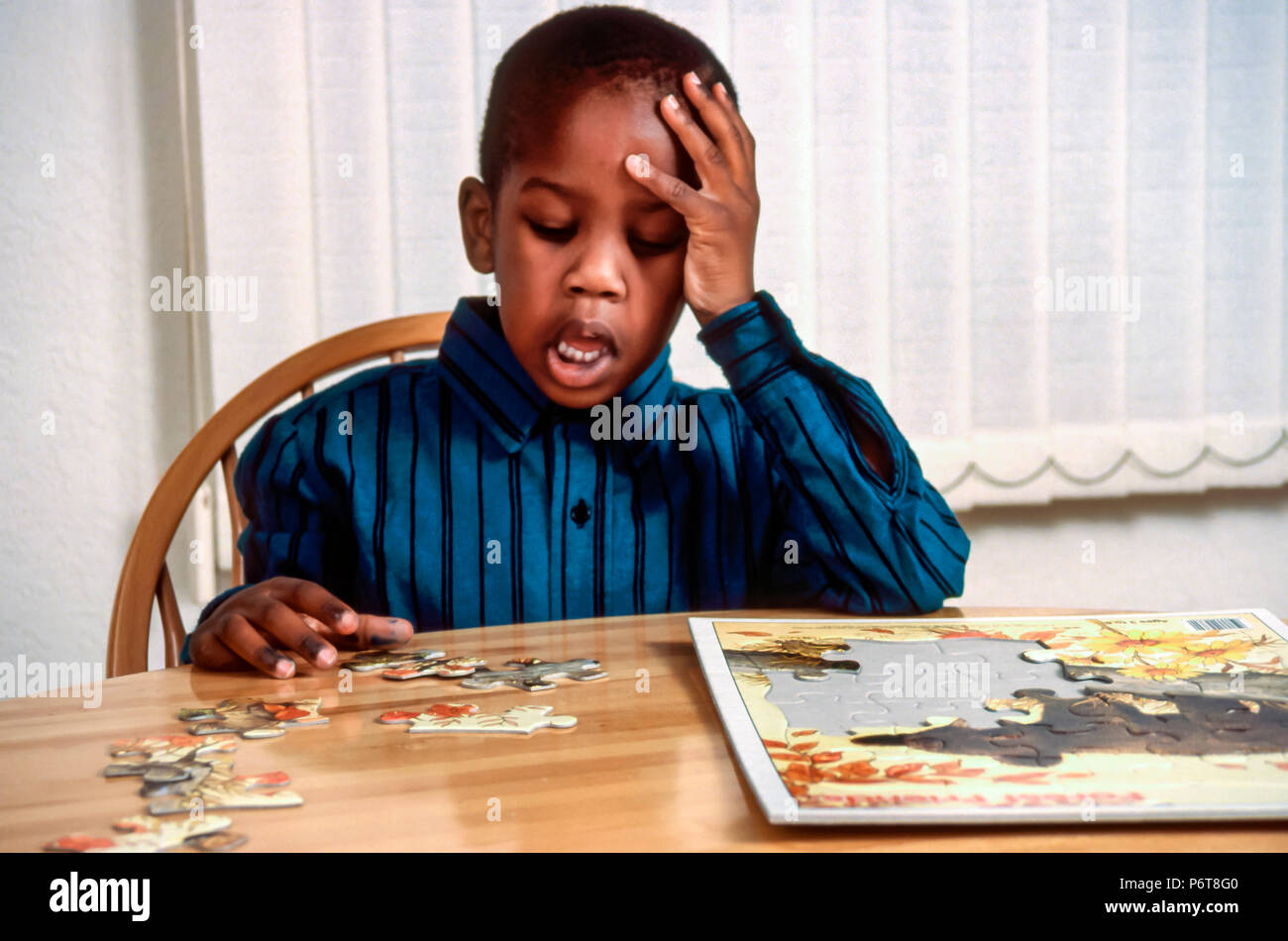 African american child puzzle hi-res stock photography and images - Alamy