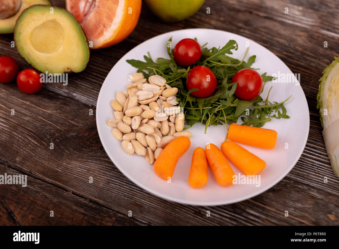 White fragile plate filling with food Stock Photo - Alamy