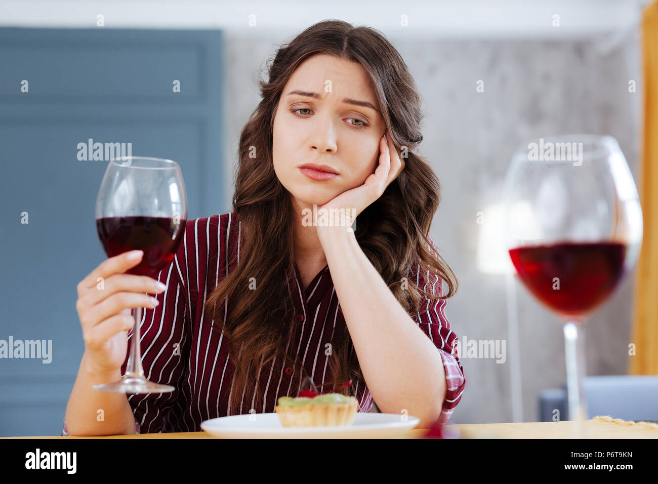 Green-eyed woman being left alone on Friday night Stock Photo - Alamy