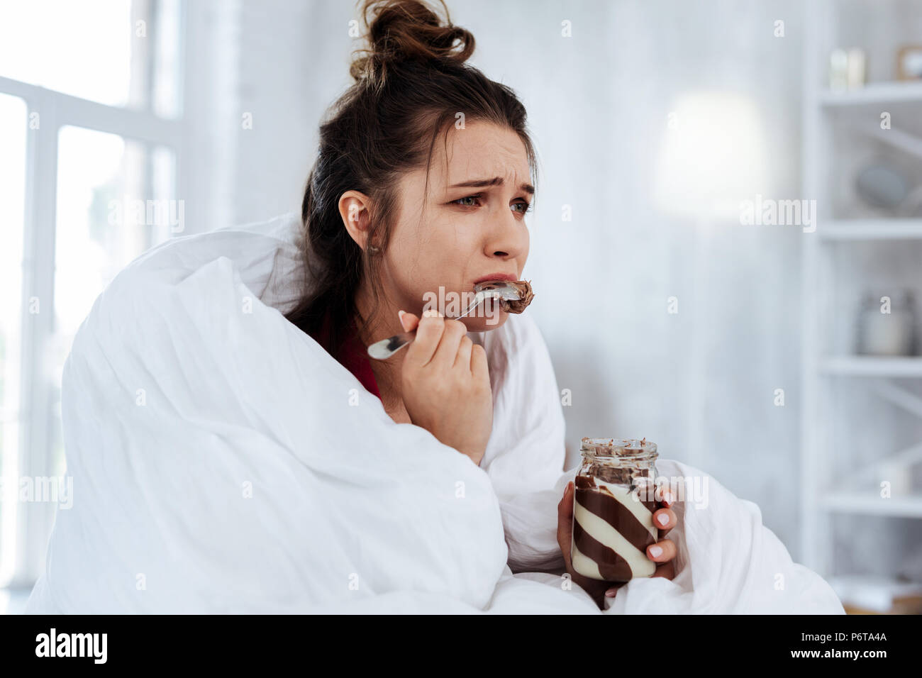Woman feeling emotional while watching melodrama Stock Photo - Alamy