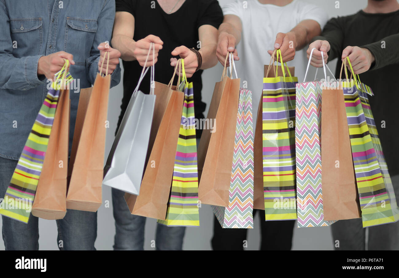 paper bags in the hands of a team of friends Stock Photo - Alamy