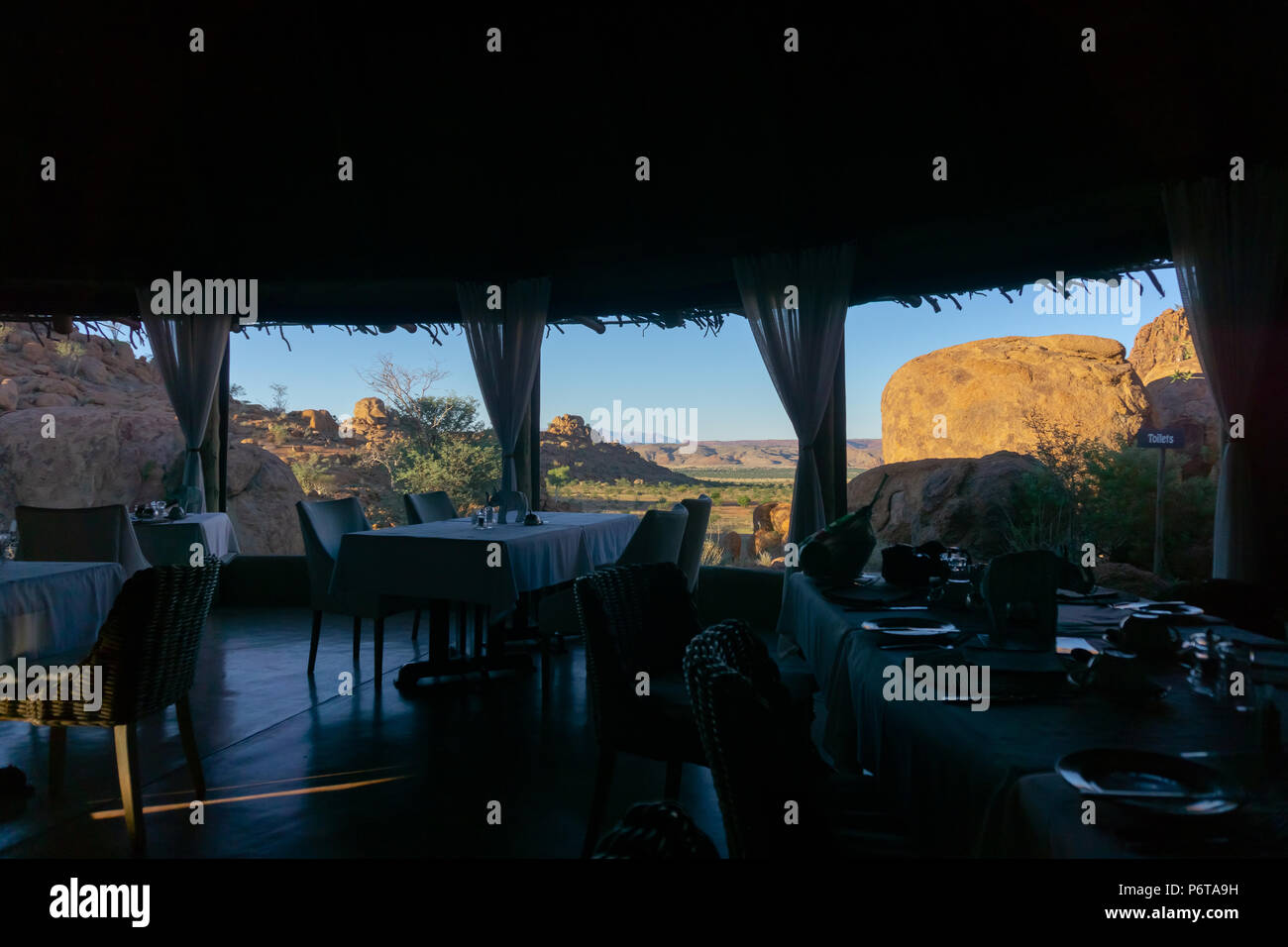 African landscape view from shady interior of dining room Namibia Stock ...