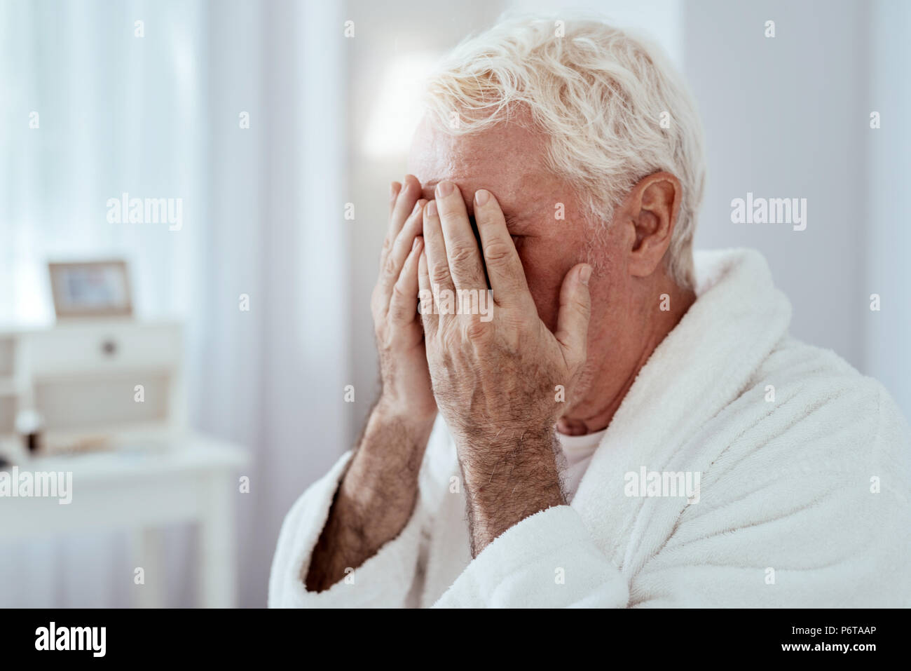Sad senior man weeping Stock Photo - Alamy