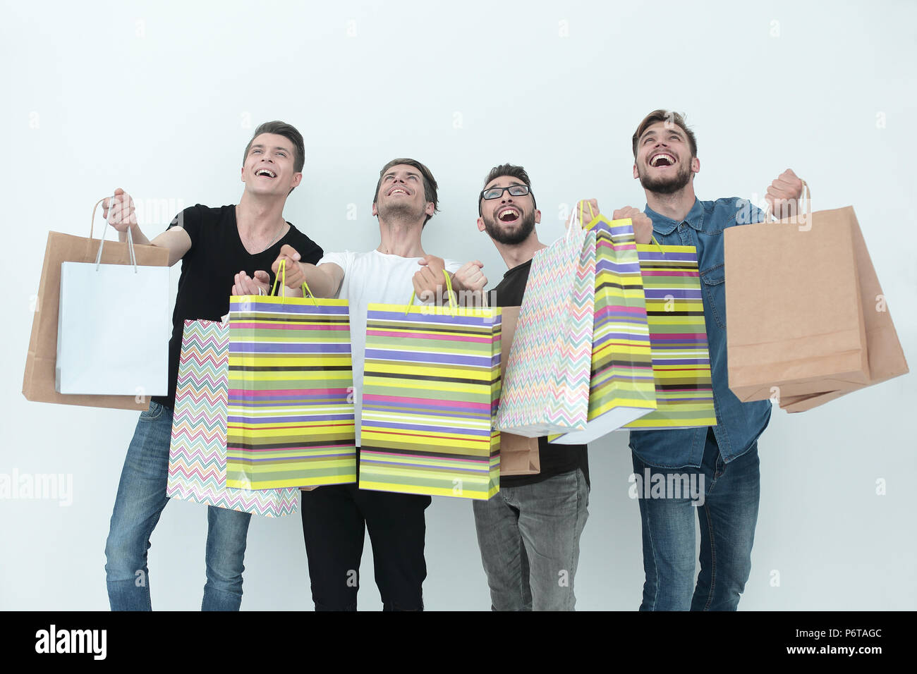 group of happy young friends with shopping bags Stock Photo - Alamy