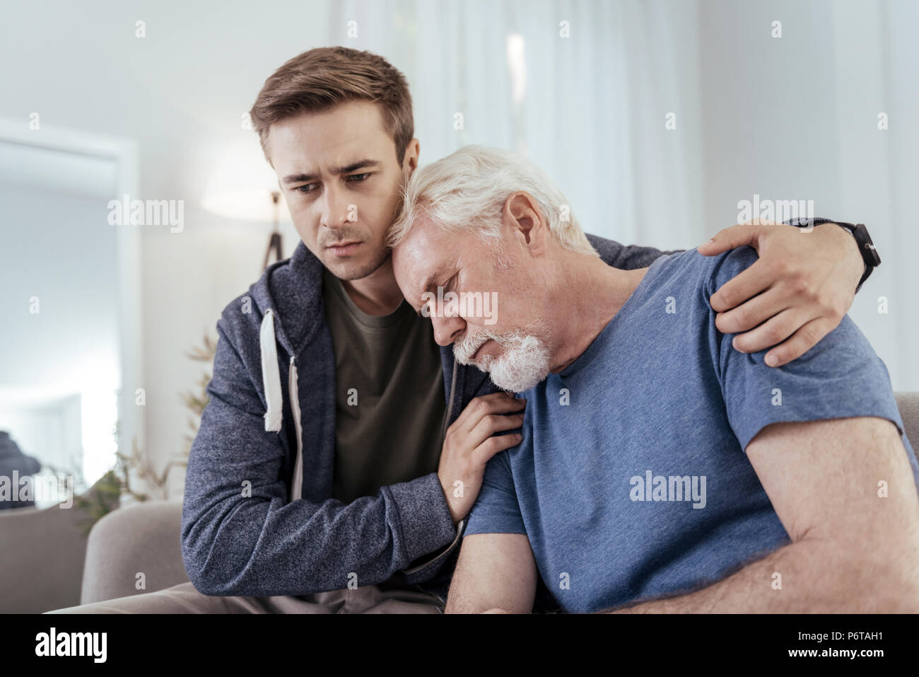 Relaxed senior man napping on shoulder Stock Photo - Alamy