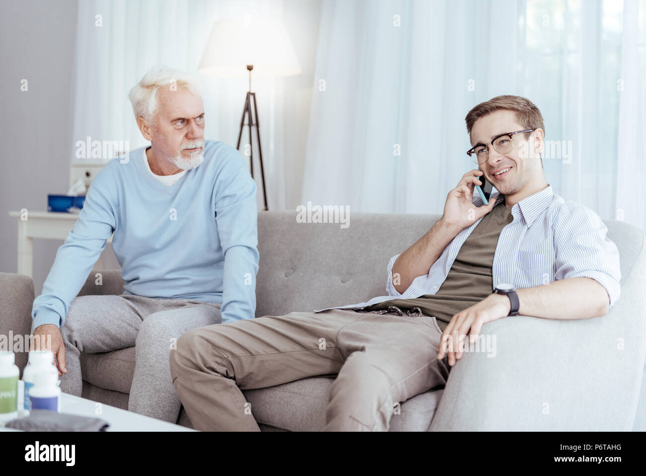 Happy attractive man making call Stock Photo - Alamy