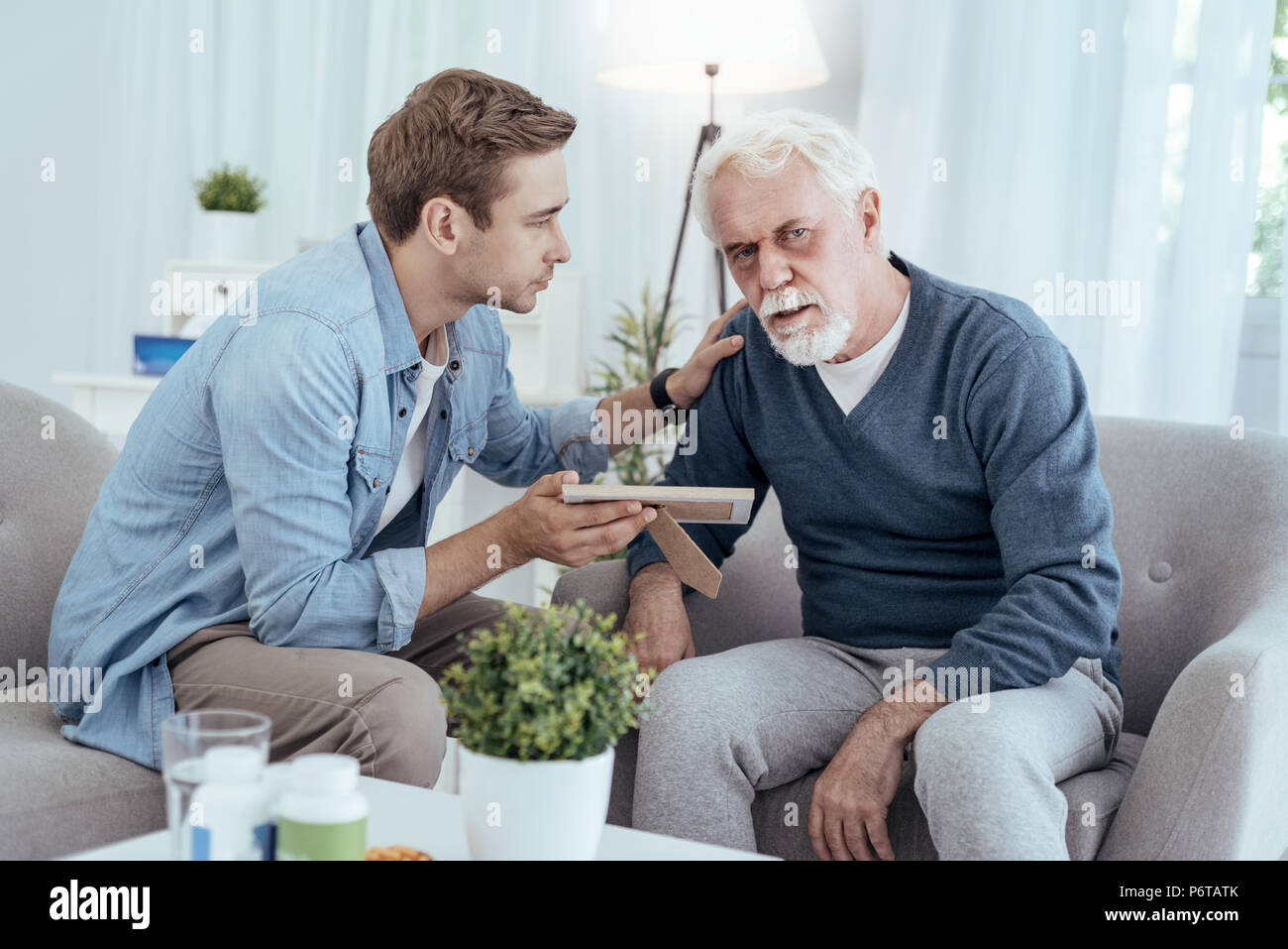 Exhausted senior man loosing memories Stock Photo - Alamy