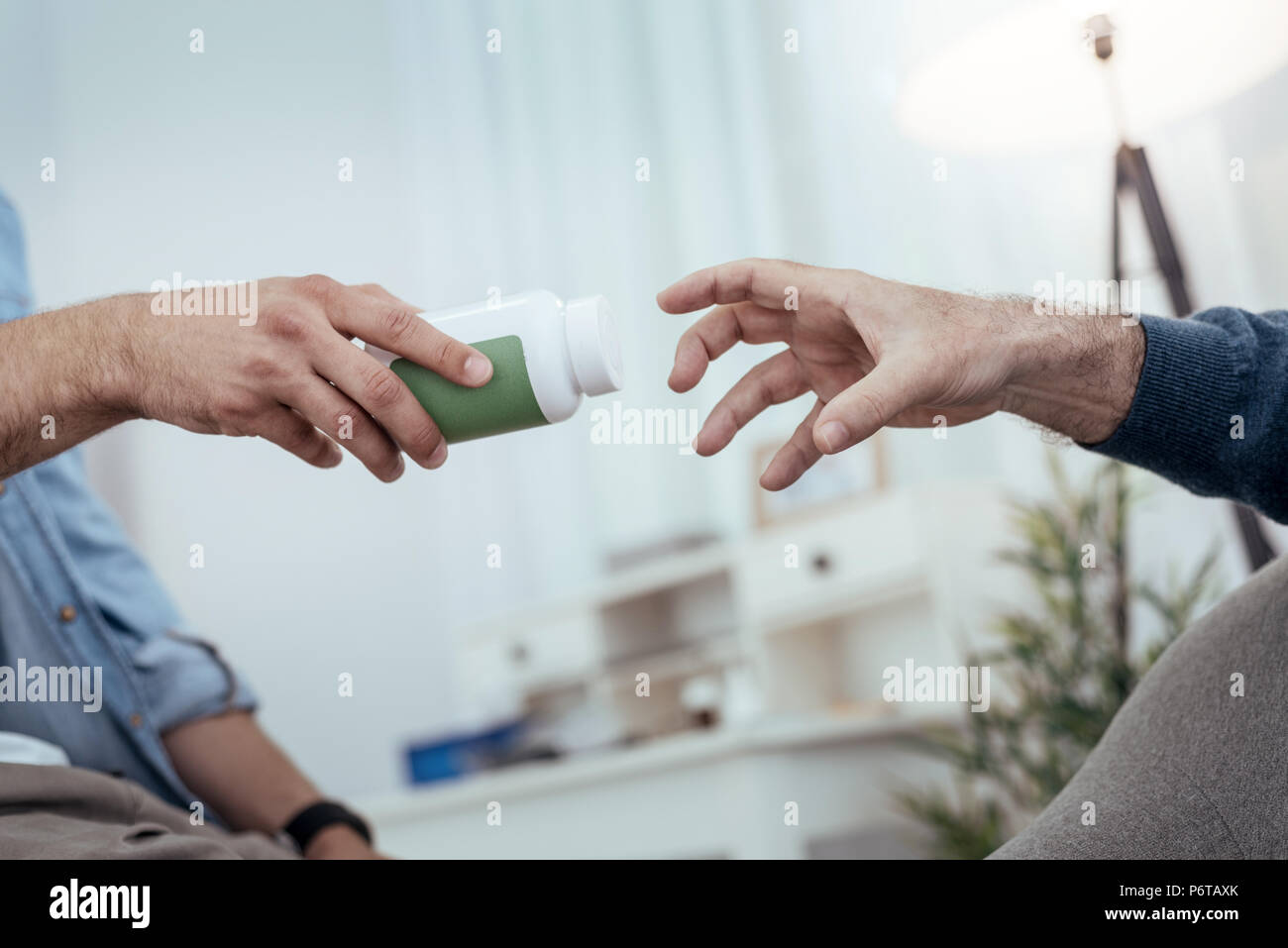 Hand grabbing drugs hi-res stock photography and images - Alamy