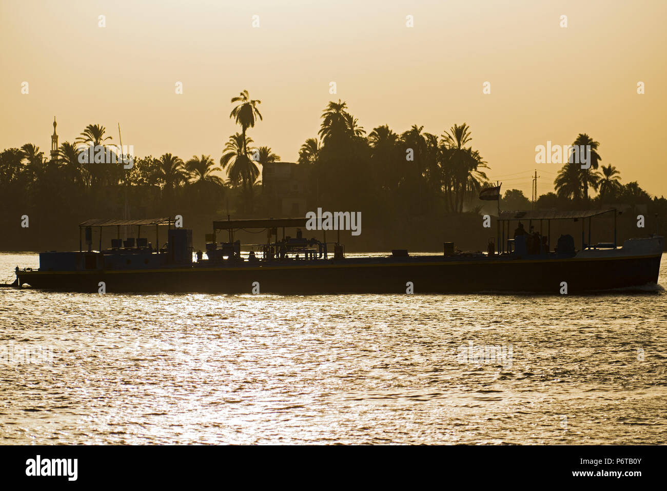 Silhouette of an old traditional barge boat traveling on river Nile ...