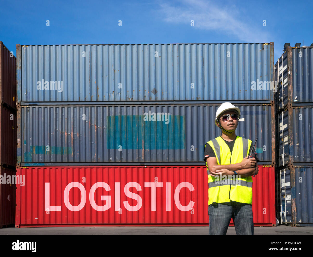 Foreman standing front Containers box from Cargo freight ship for ...