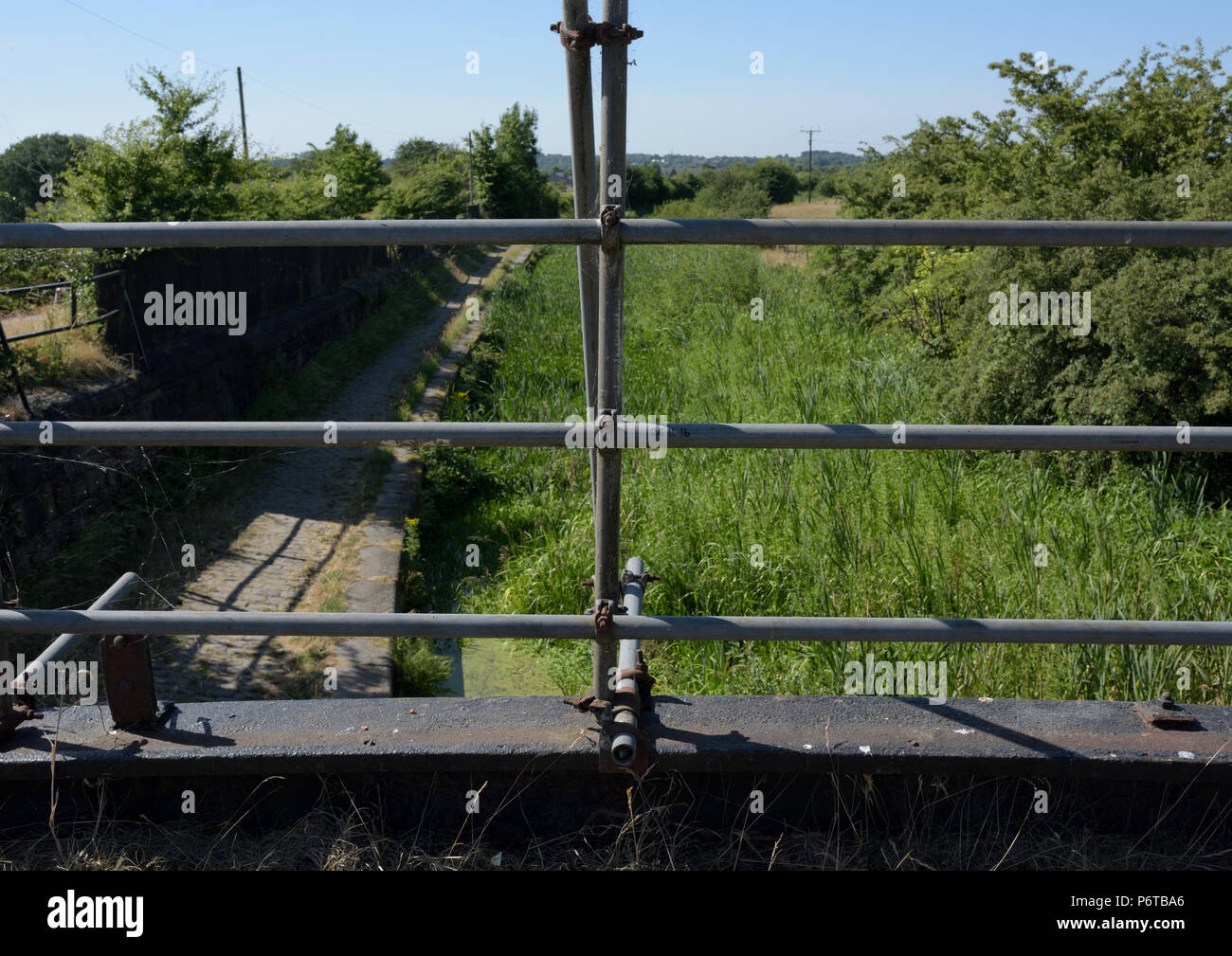 Scaffolding used as temporary safety fencing on bridge over canal in ...