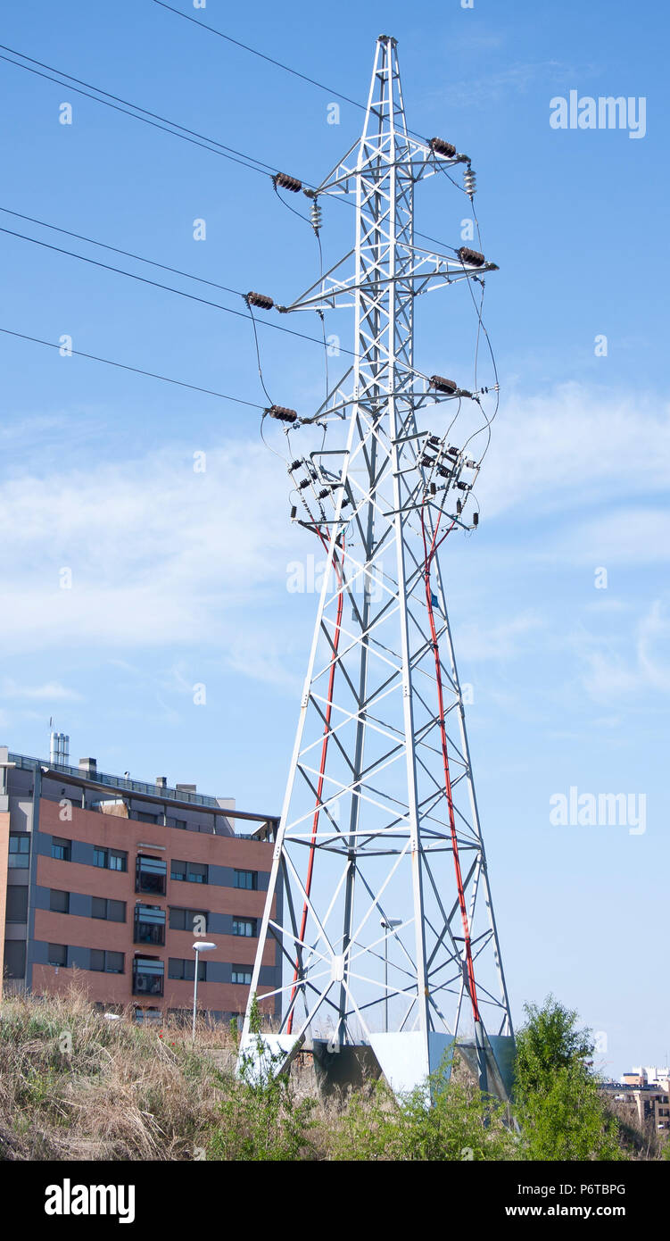 a high voltage tower in a city Stock Photo - Alamy