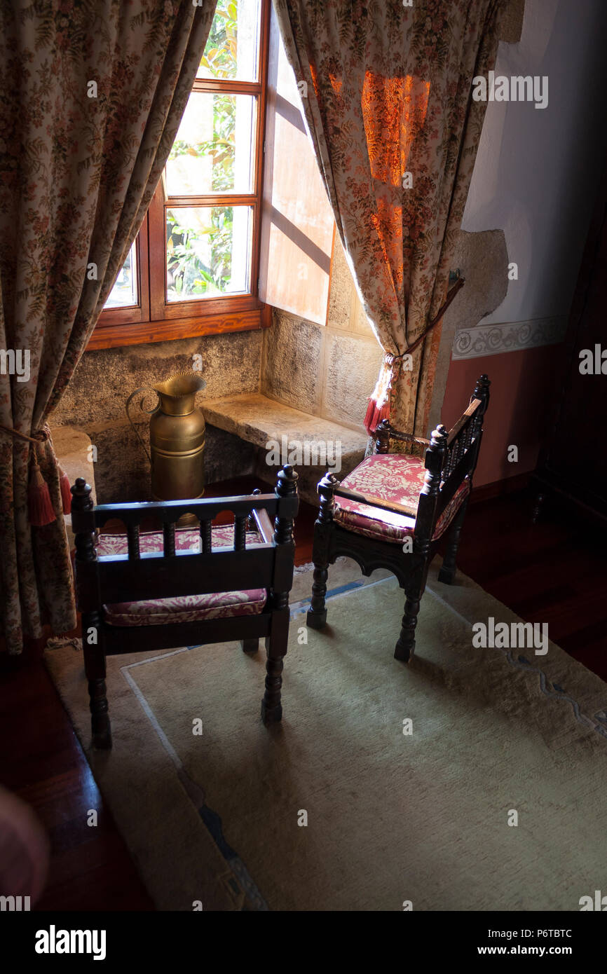 rustic chairs in front of a window Stock Photo - Alamy