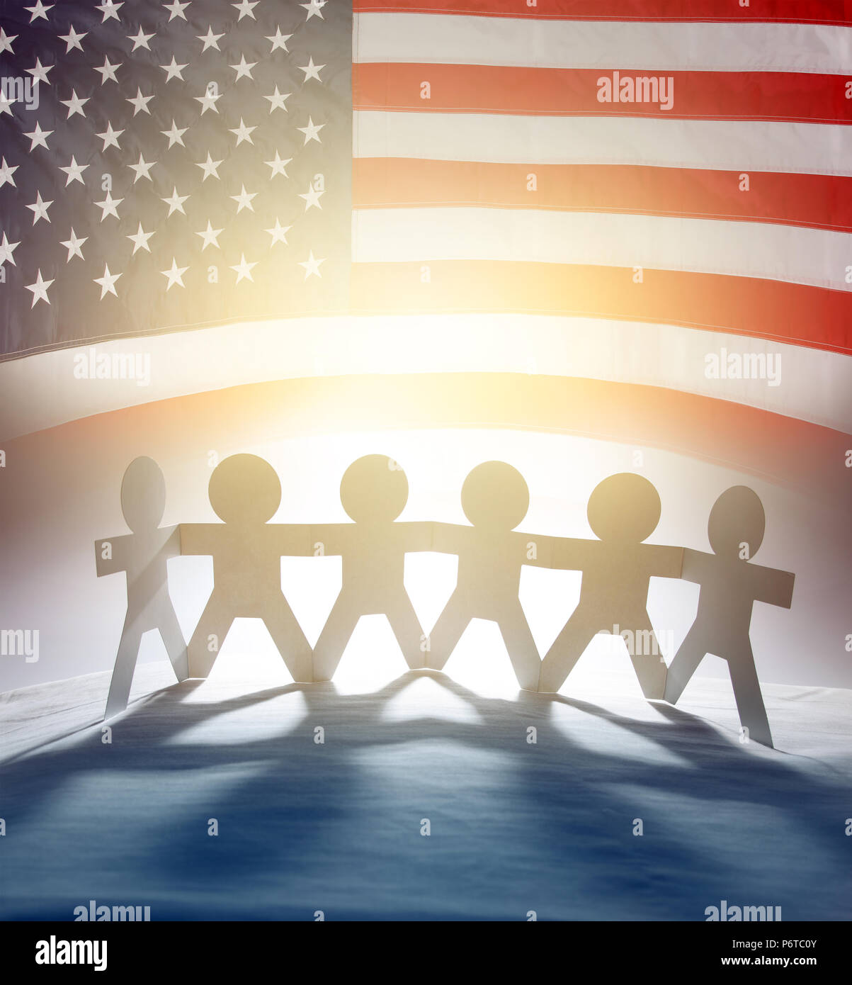 Team in front of American flag Stock Photo - Alamy