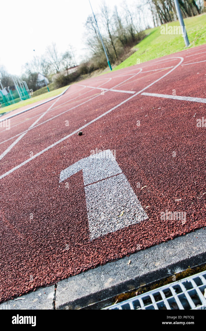 red rubber racetracks in outdoor stadium Stock Photo - Alamy