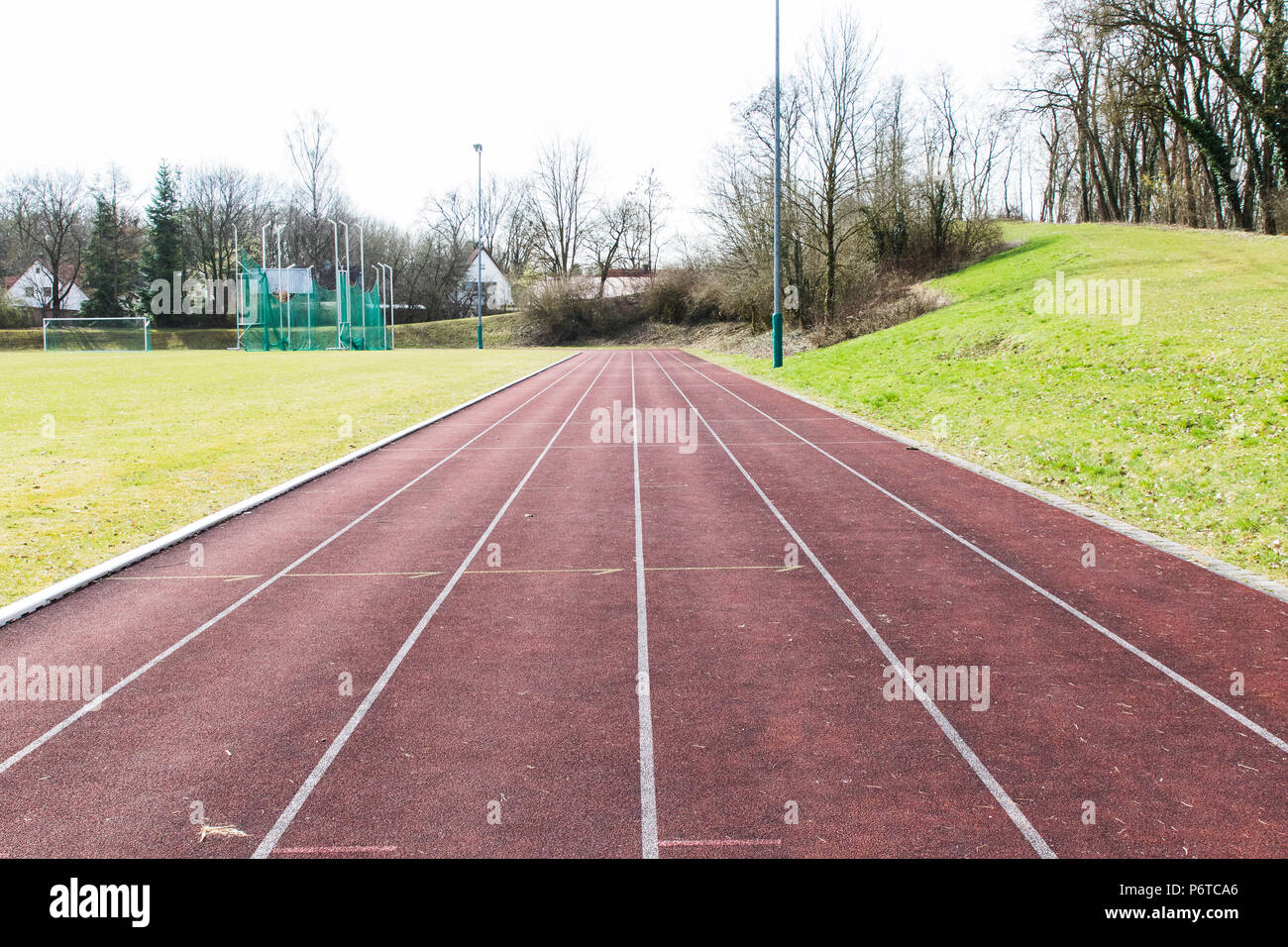 red rubber racetracks in outdoor stadium Stock Photo - Alamy