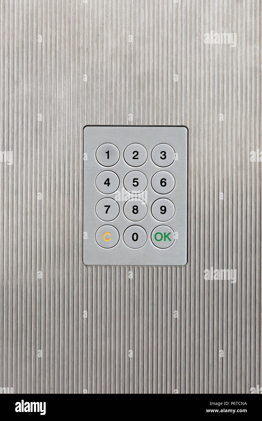 Keypad buttons for secure access at wall Stock Photo - Alamy