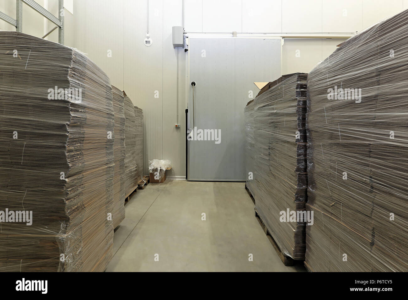 Cardboard boxes packaging material in storage room Stock Photo - Alamy